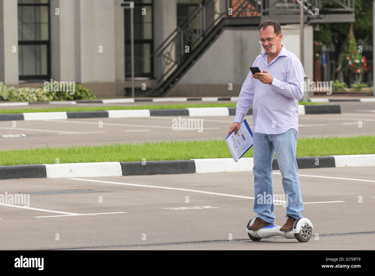 Business man riding an electronic scooter outdoors - personal portable ...