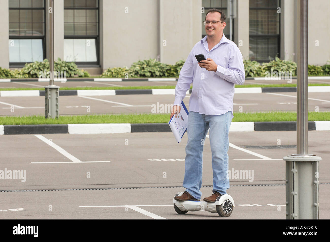 Business man riding an electronic scooter outdoors - personal portable ...