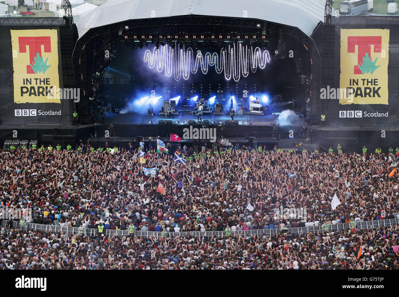 The crowd watching the Arctic Monkeys performing on the Main Stage at ...