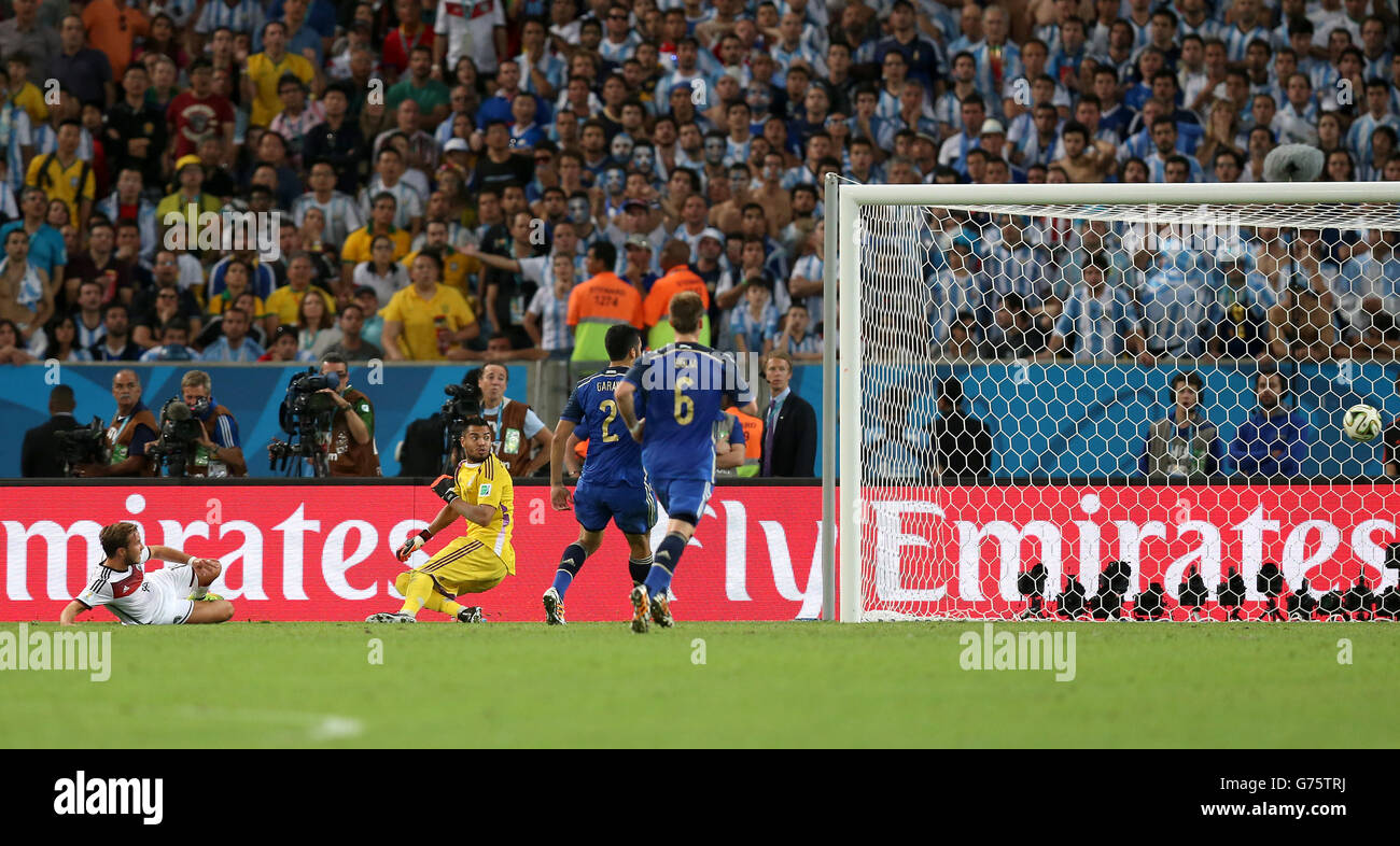 Germany's Mario Gotze (left) scores his team's opening goal past ...