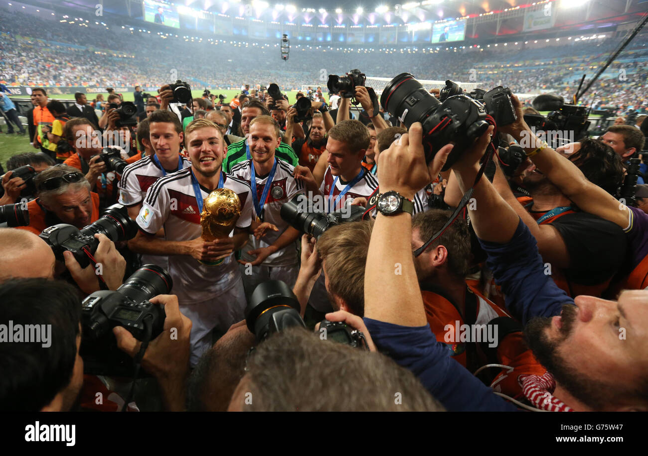 Germany's Christoph Kramer celebrates with the trophy in front of ...