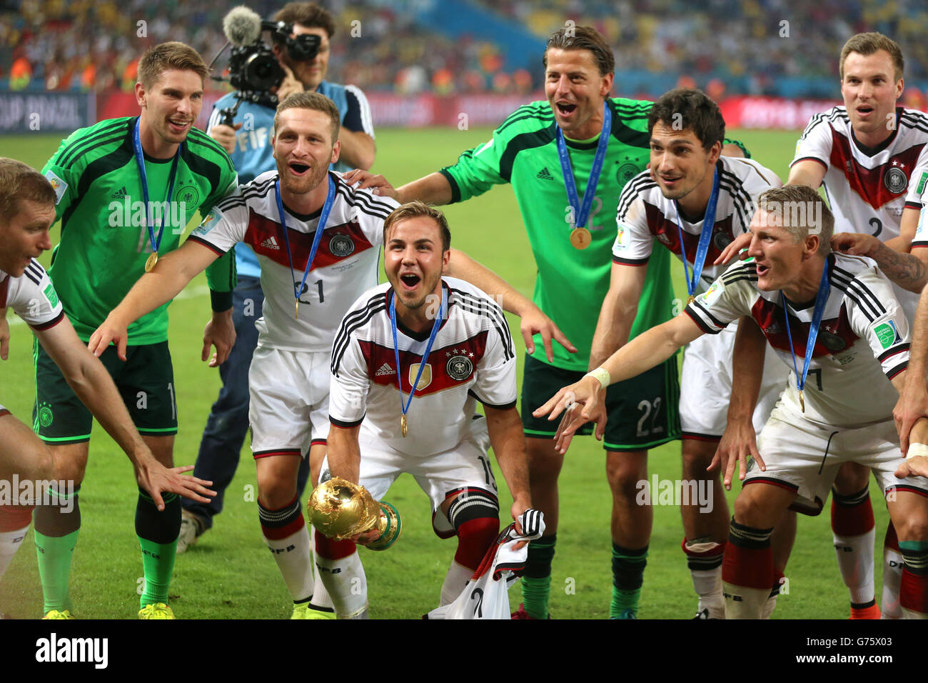 Germanys mario gotze celebrates with the fifa world cup trophy hi-res ...
