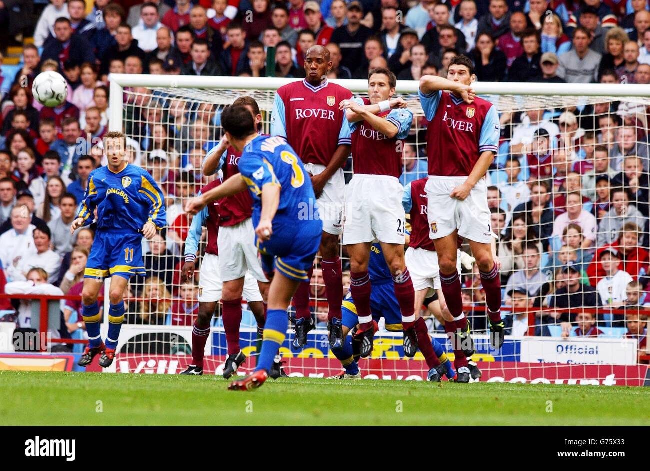 Villa's wall of defenders tries to block a free kick by Leed's Ian ...