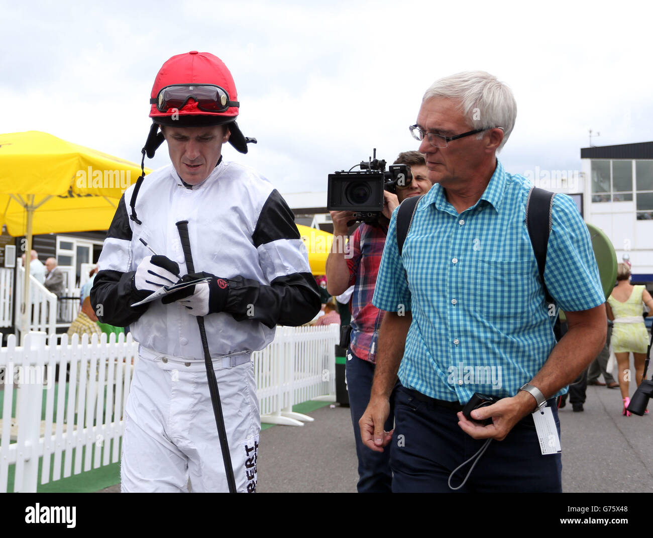 Jockey Tony McCoy signs an autograph for a fan prior to The 32Red ...