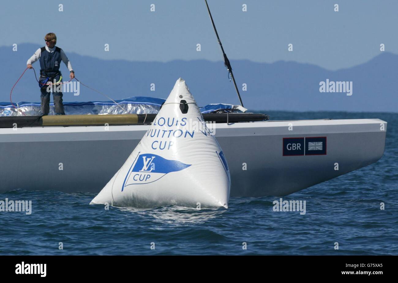 Bow man Matt Cornwell of Team GBR watches as his yacht Wight Lightning ...