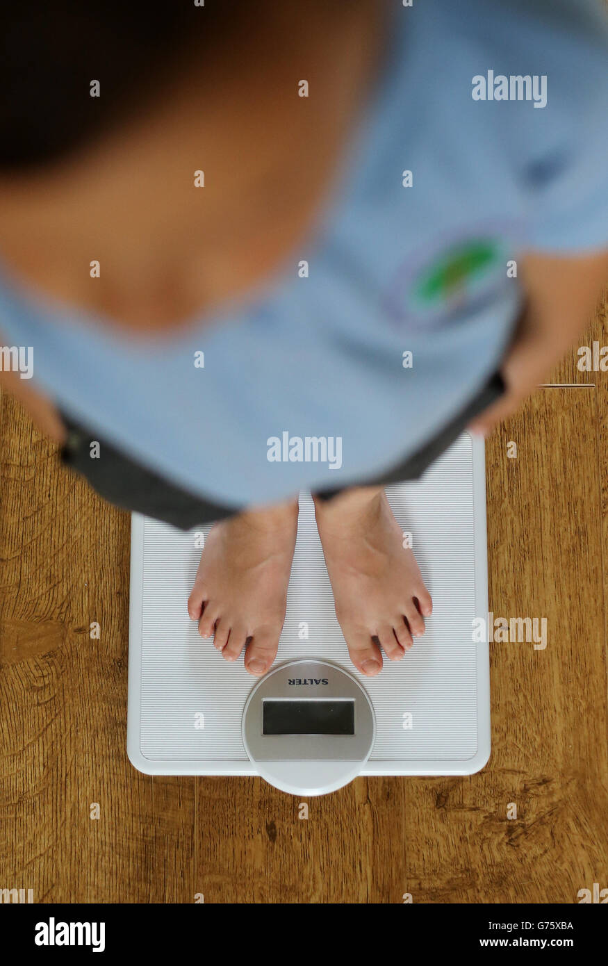 Child being weighed Stock Photo - Alamy