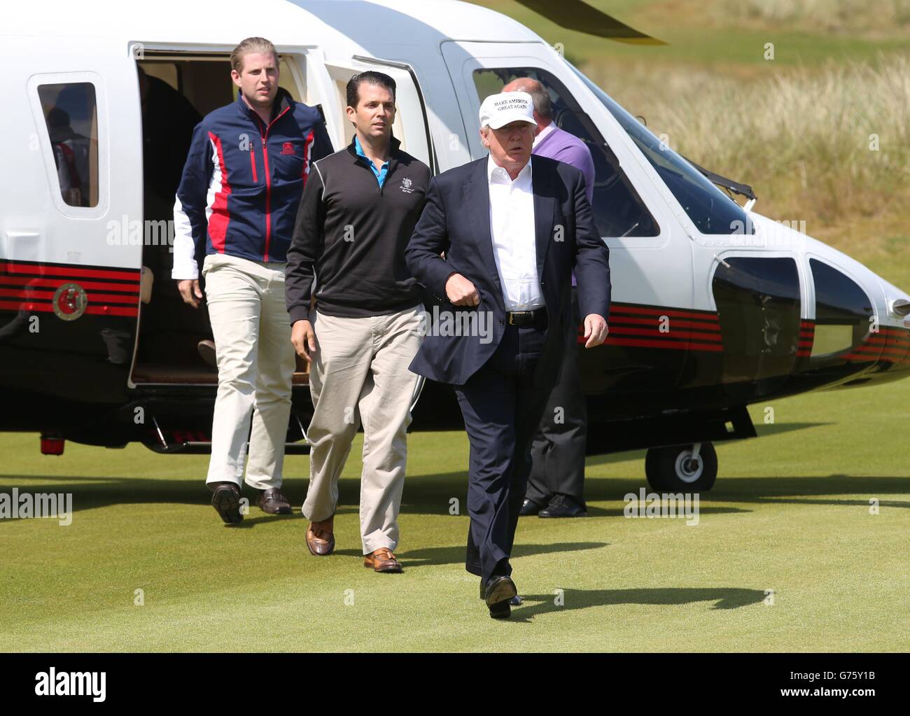 Donald Trump arrives by helicopter for a tour of the Trump ...