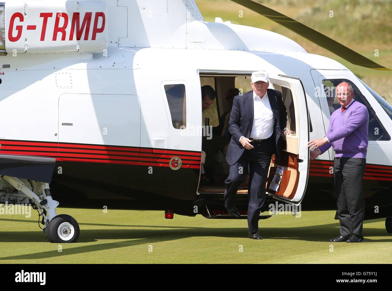 Donald Trump arrives by helicopter for a tour of the Trump ...