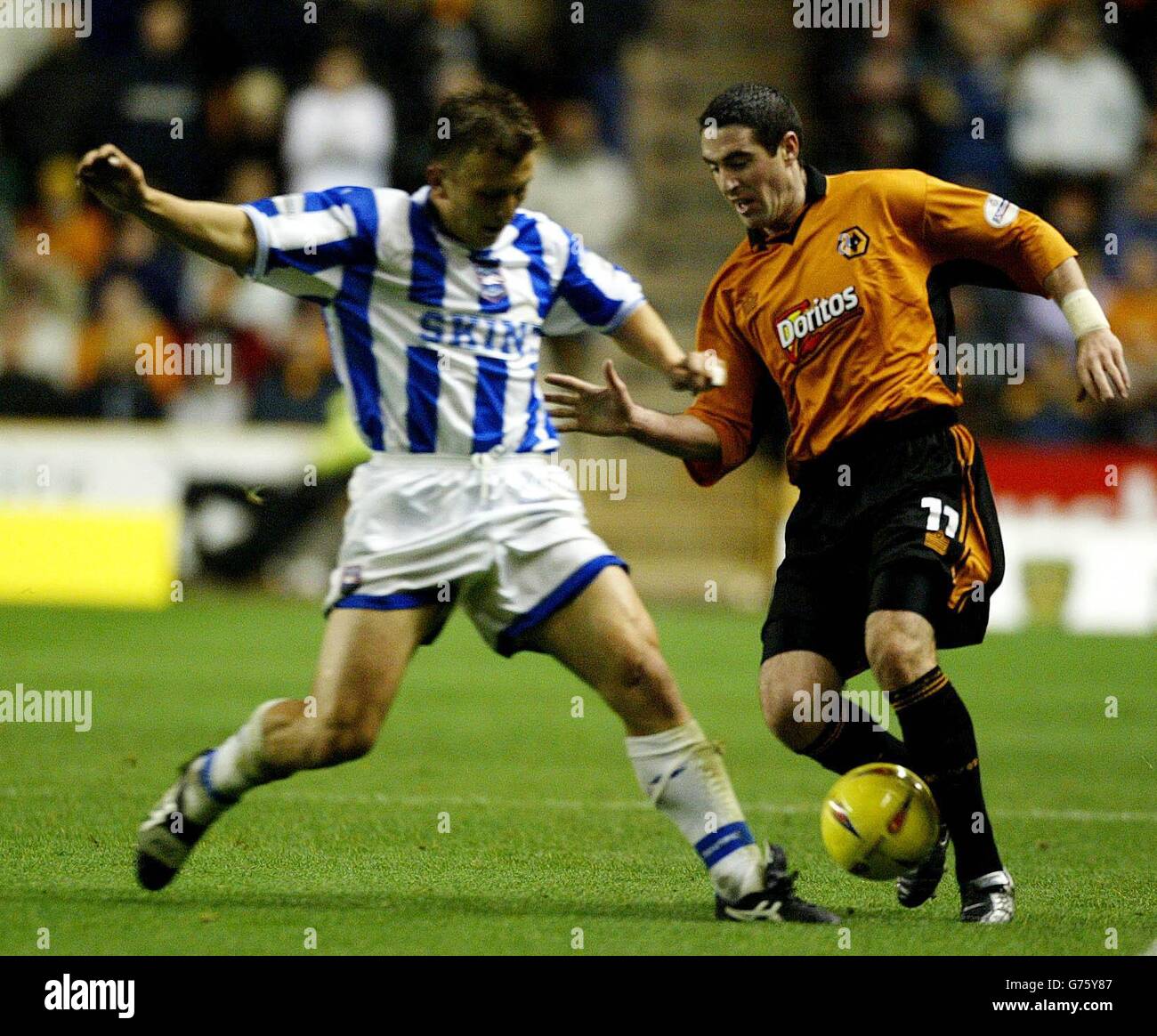 Wolverhampton Wanderers Mark Kennedy is tackled by Brighton's Gary Hart ...