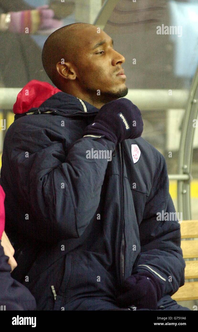 Liverpool's new signing Nicolas Anelka on the bench before the FA ...