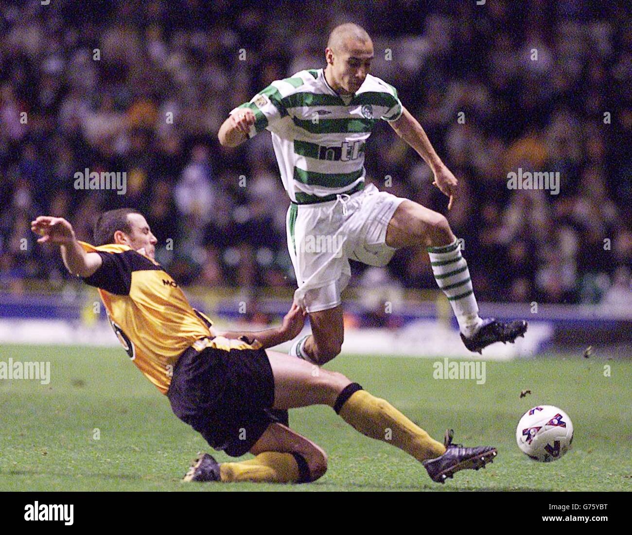 Celtics's Henrik Larsson jumps over Livingston's John ANderson during ...