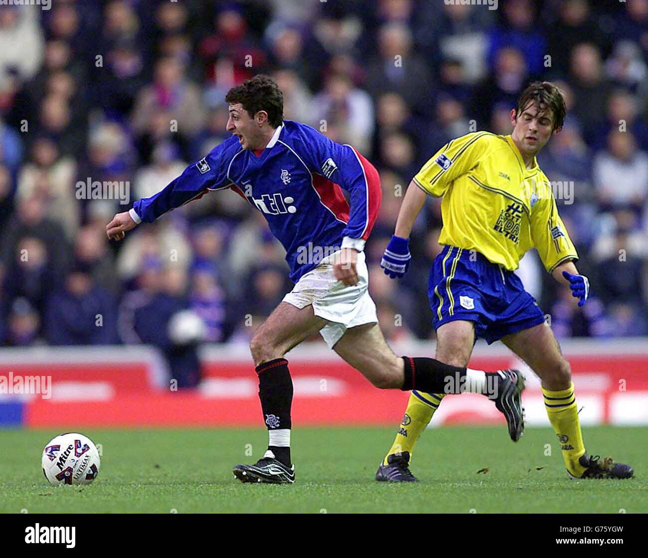 Rangers' Shota Arveladze passes St Johnstone's Paul Hartley, during ...