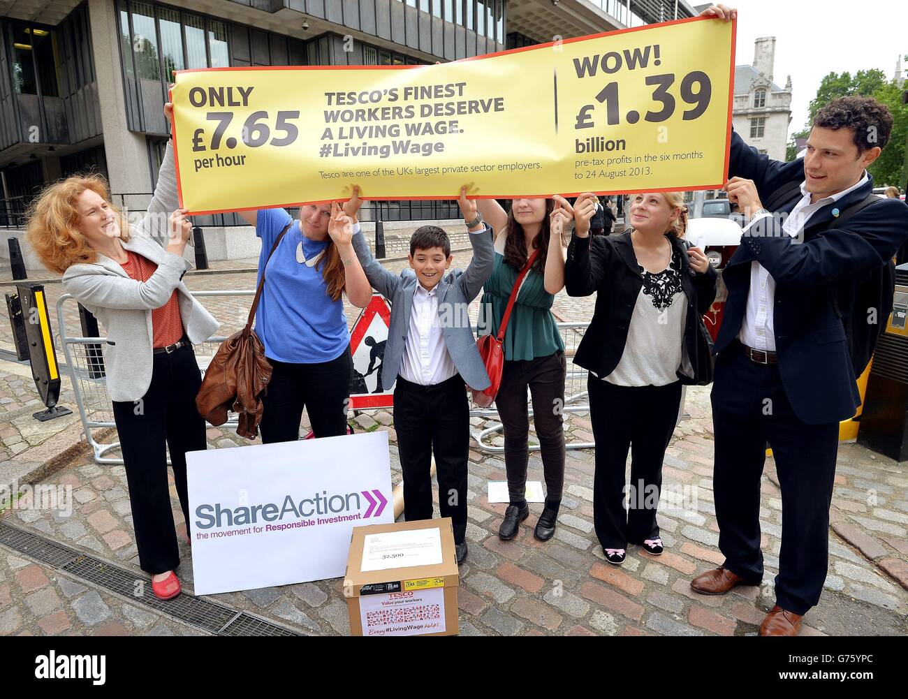 A small group of people from protest group ShareAction demonstrate ...