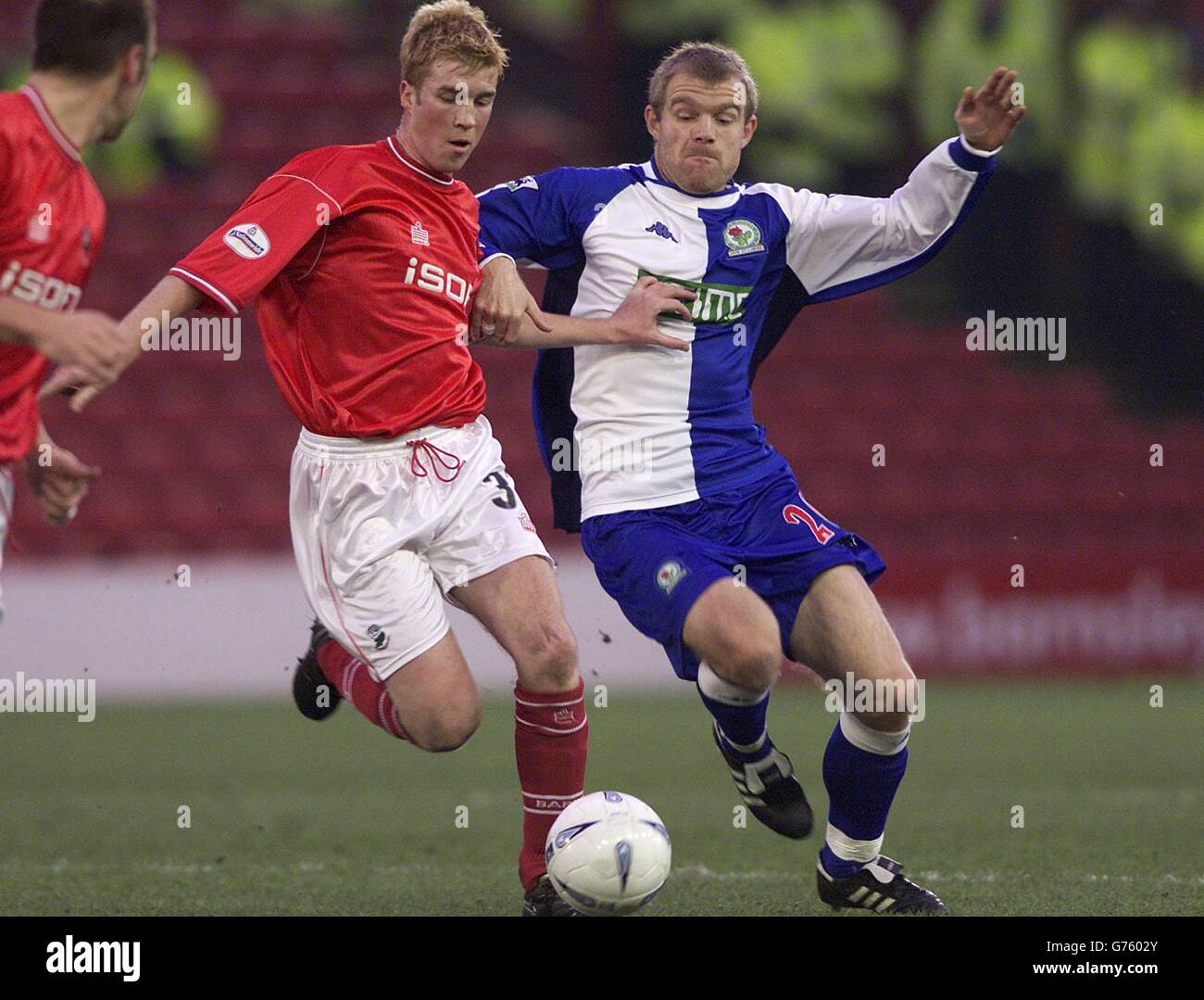 Blackburn's Egil Ostenstad battles with Barnsley's Chris Lumsdon (left ...