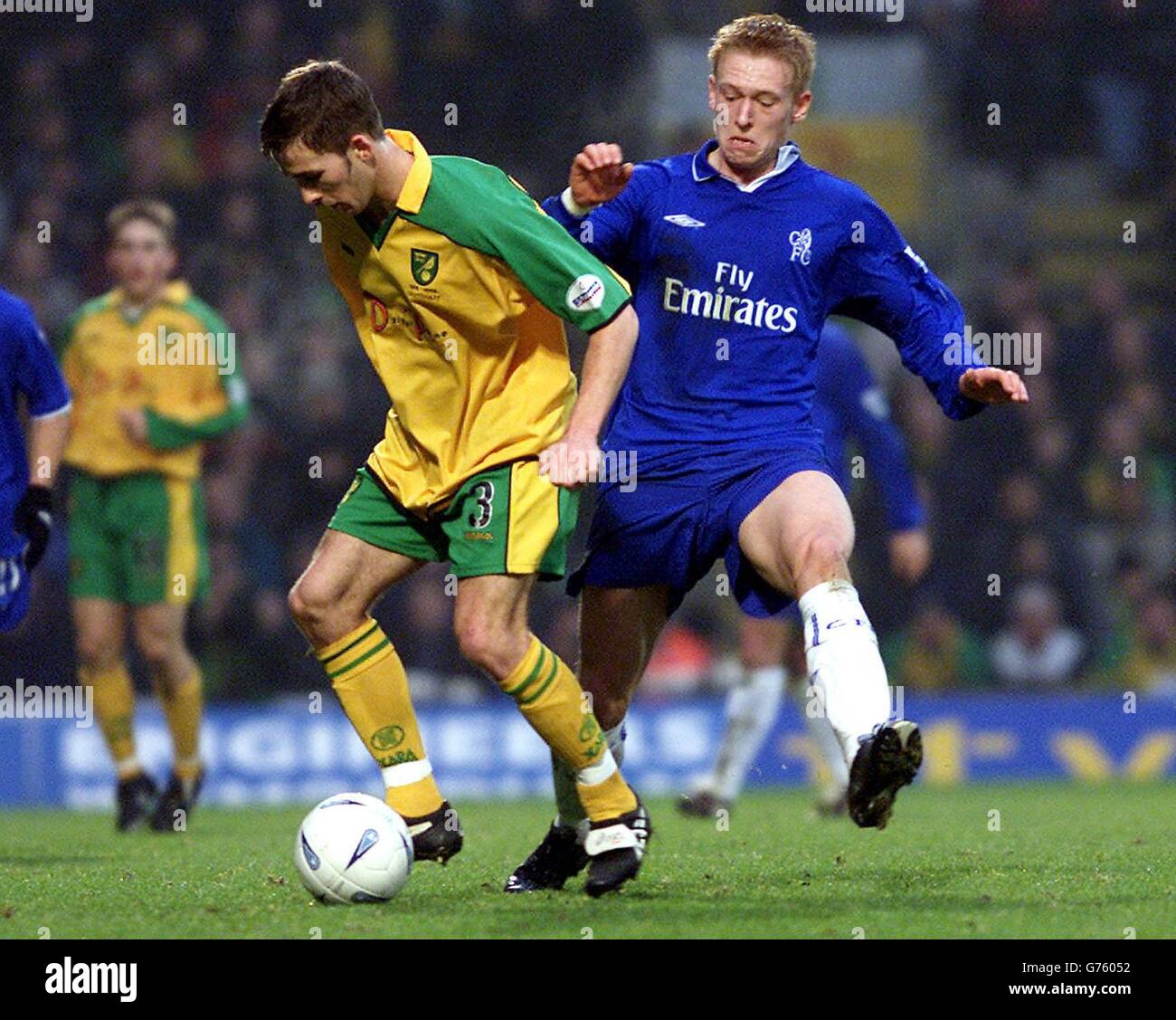 Norwich City's Adam Drury (L) and Chelsea's Mikael Forssell in action ...