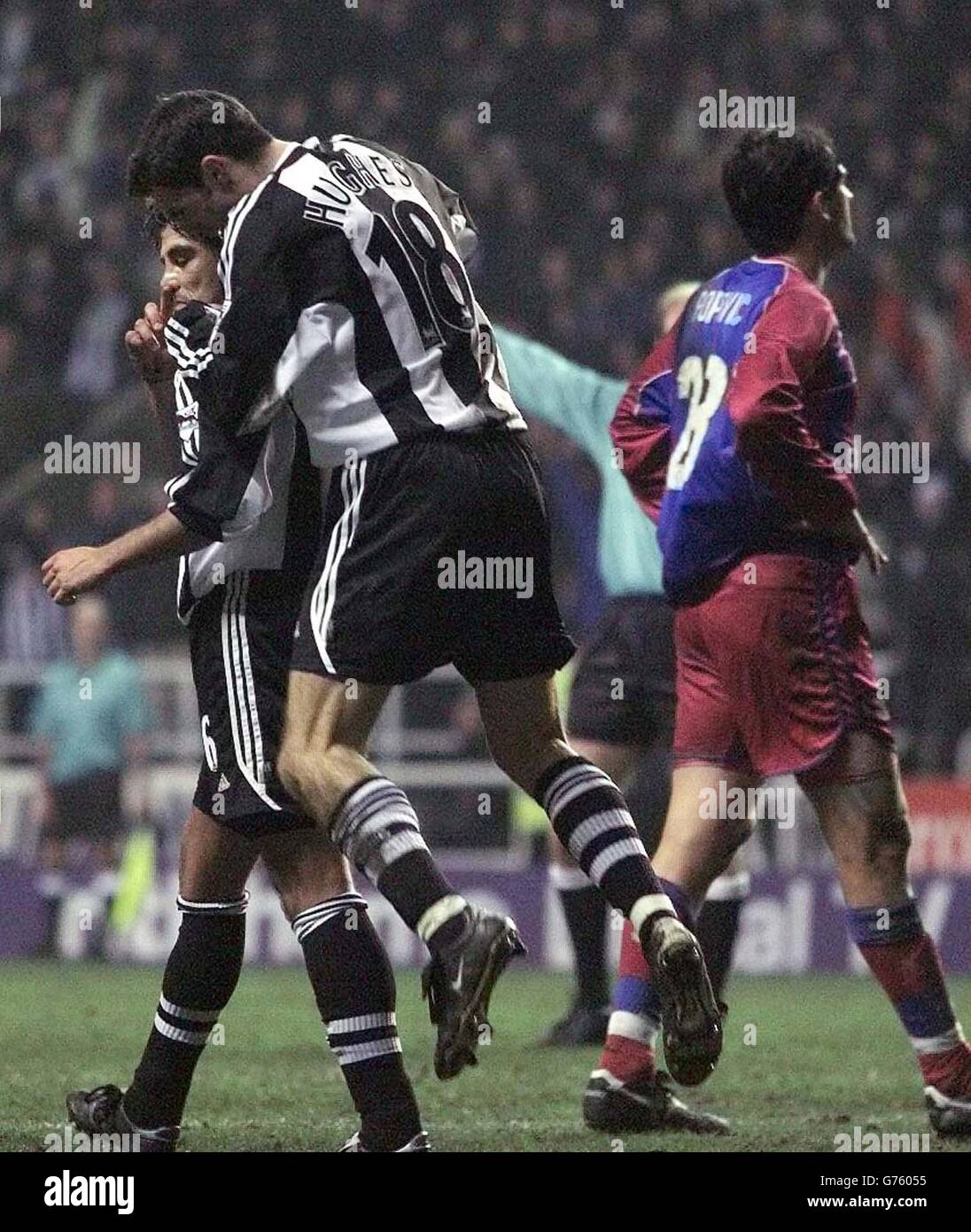 Newcastle's Clarence Acuna (left) is congratulated by teammate Aaron ...