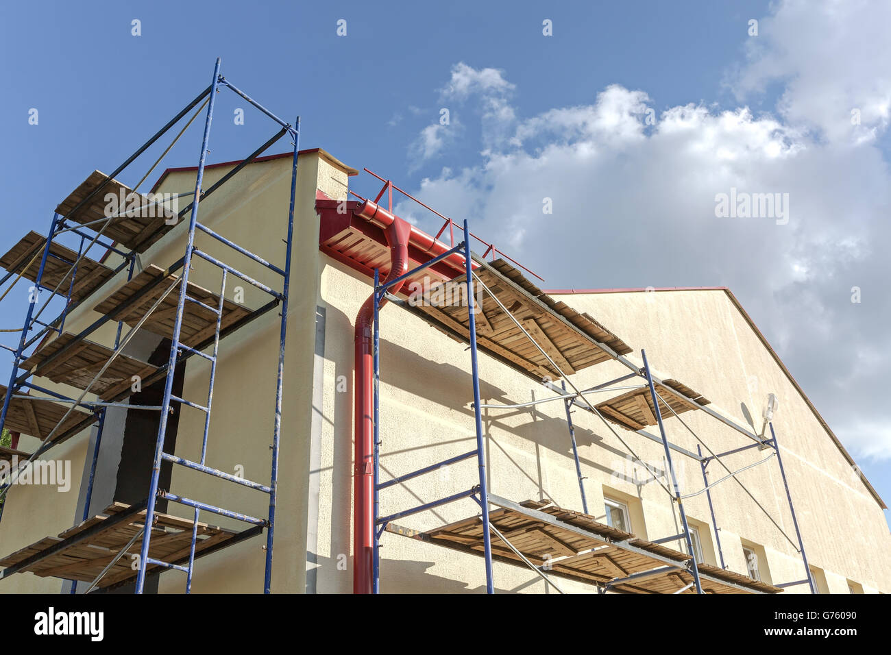scaffolding near facade wall of building on construction site Stock ...