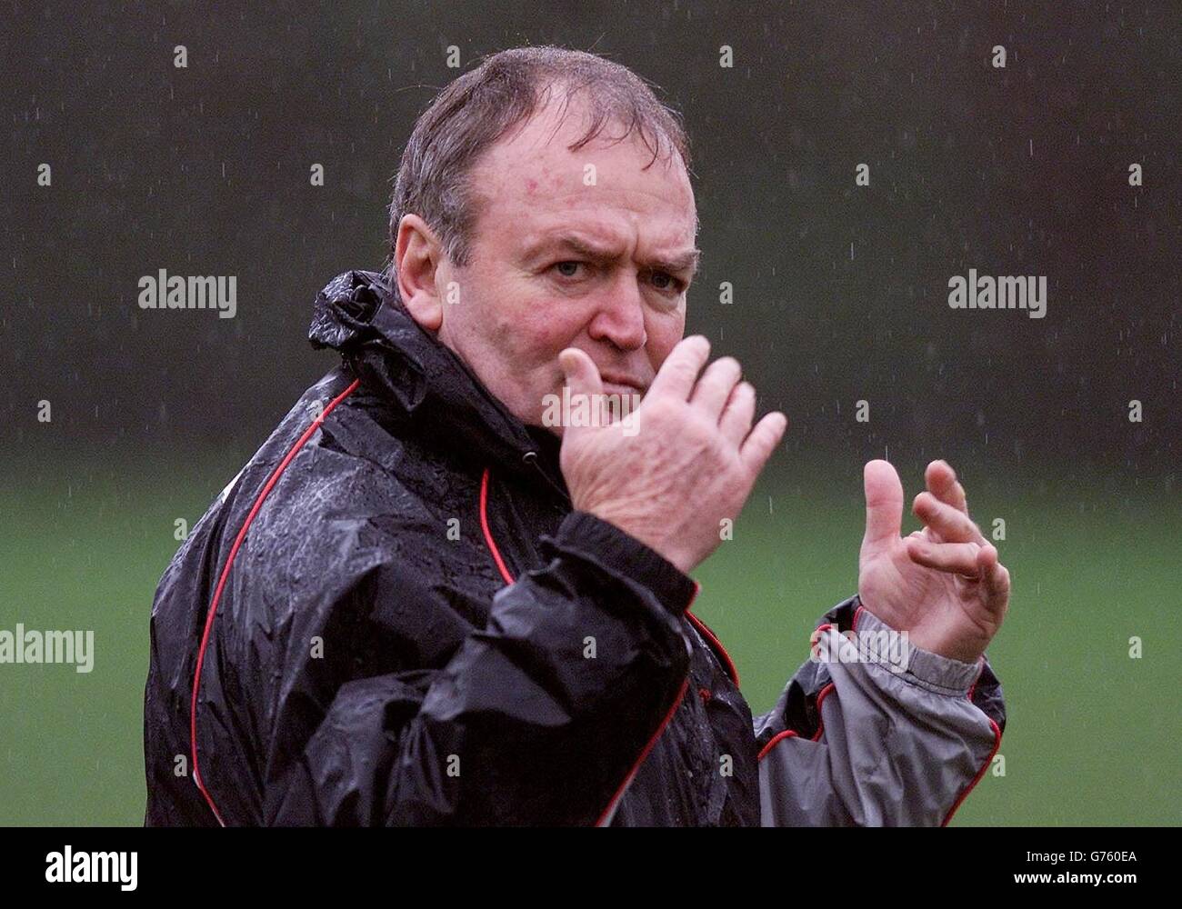 Wales' Head coach Graham Henry watches training at Sophia Gardens ...
