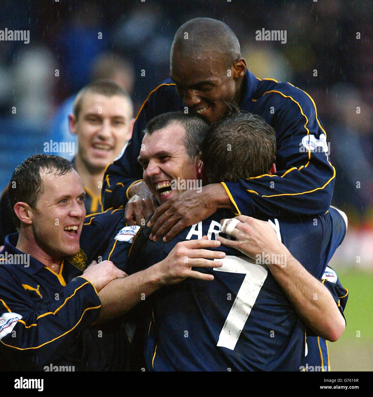Wimbledon's Neil Shipperley (centre) is mobbed by team mates after ...