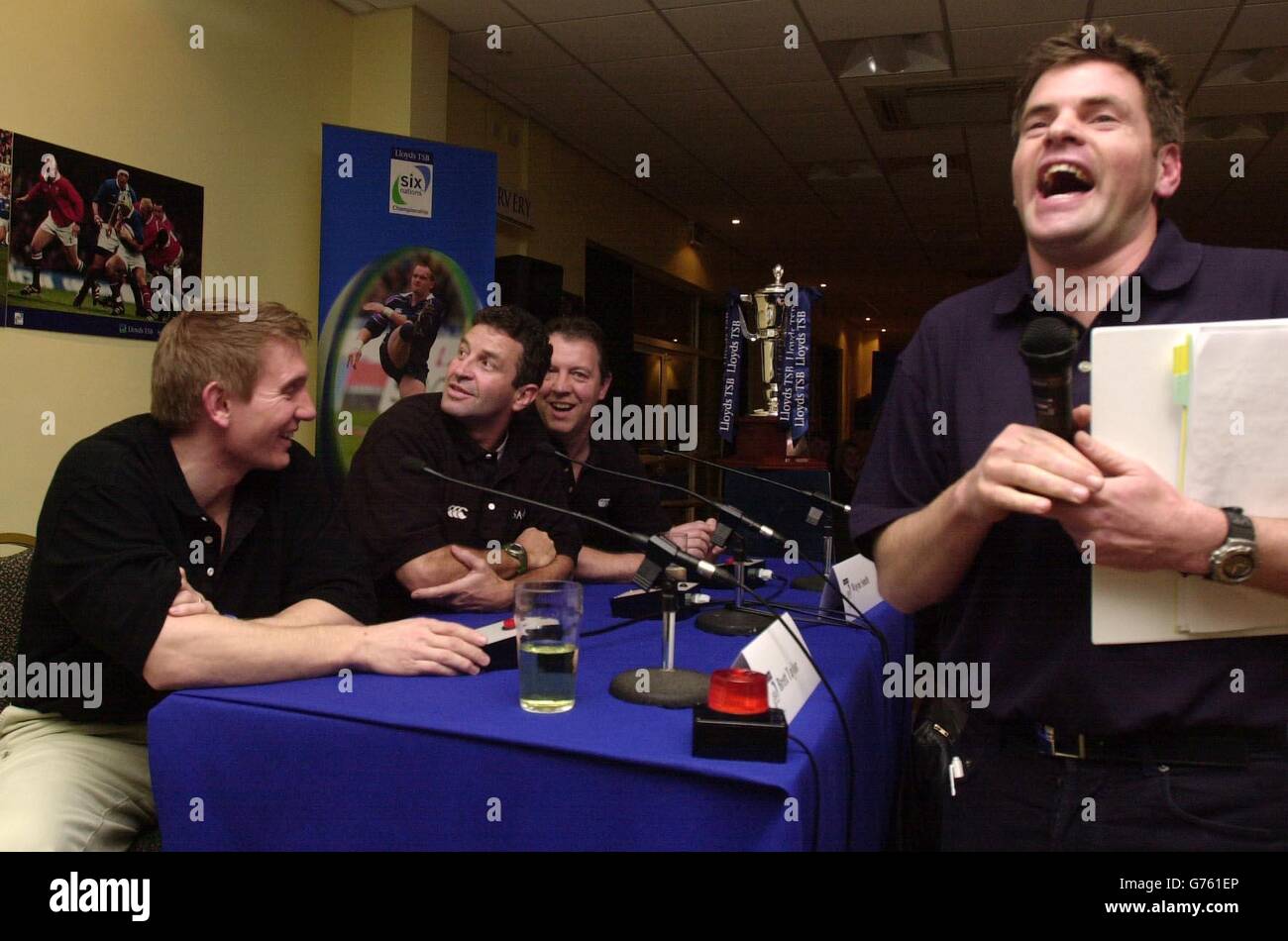Compere Mark Durden-Smith, (right), shares a joke with quiz team (l/r ...