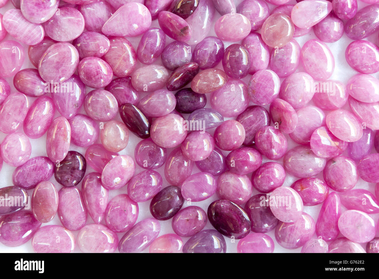 pink rose quartz. circle-shaped polished on white background Stock ...