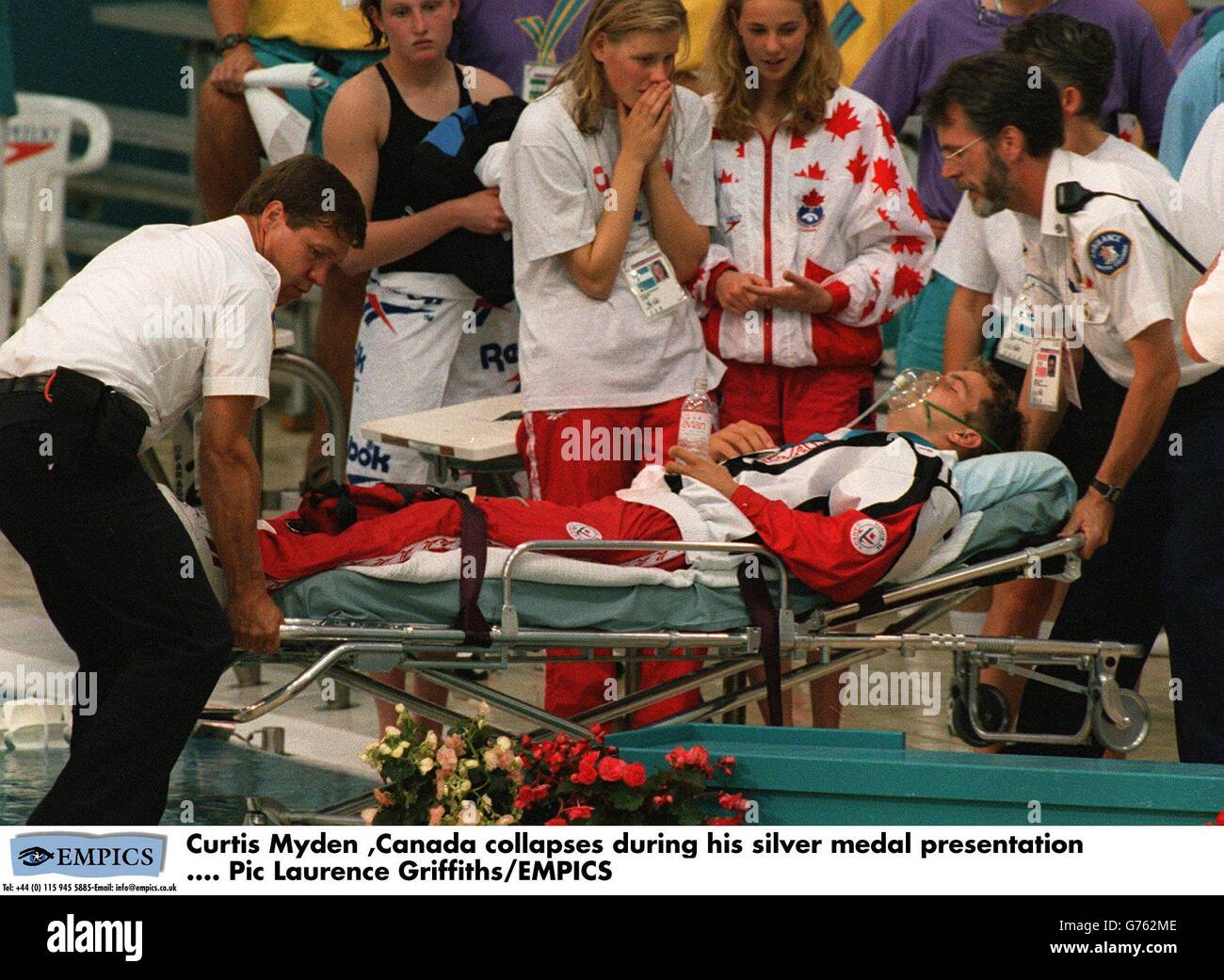 Curtis Myden ,Canada collapses during his silver medal presentation ...