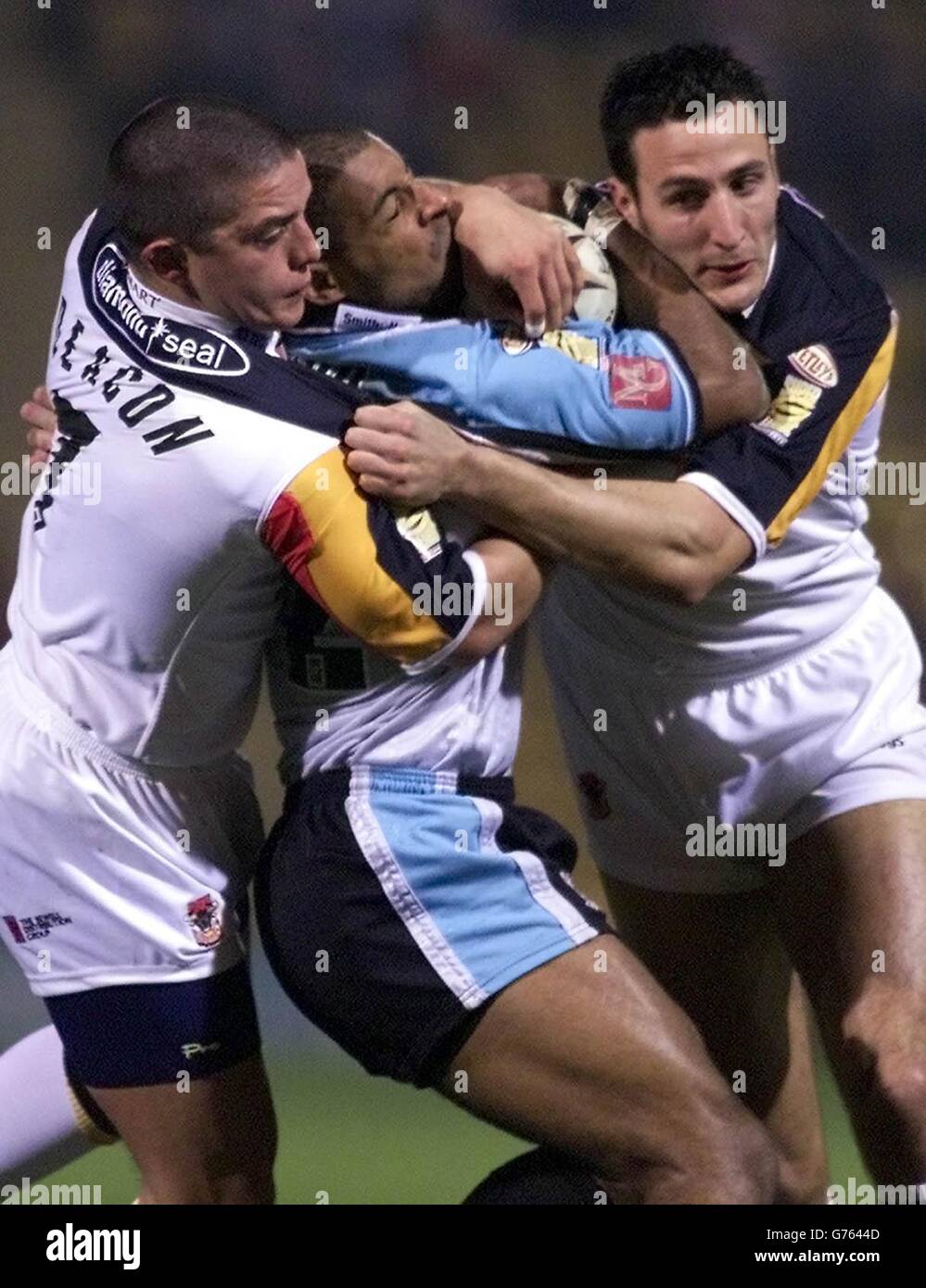 Bradford Bulls' Paul Deacon and Lee Gilmour (right) stop Hull FC's ...