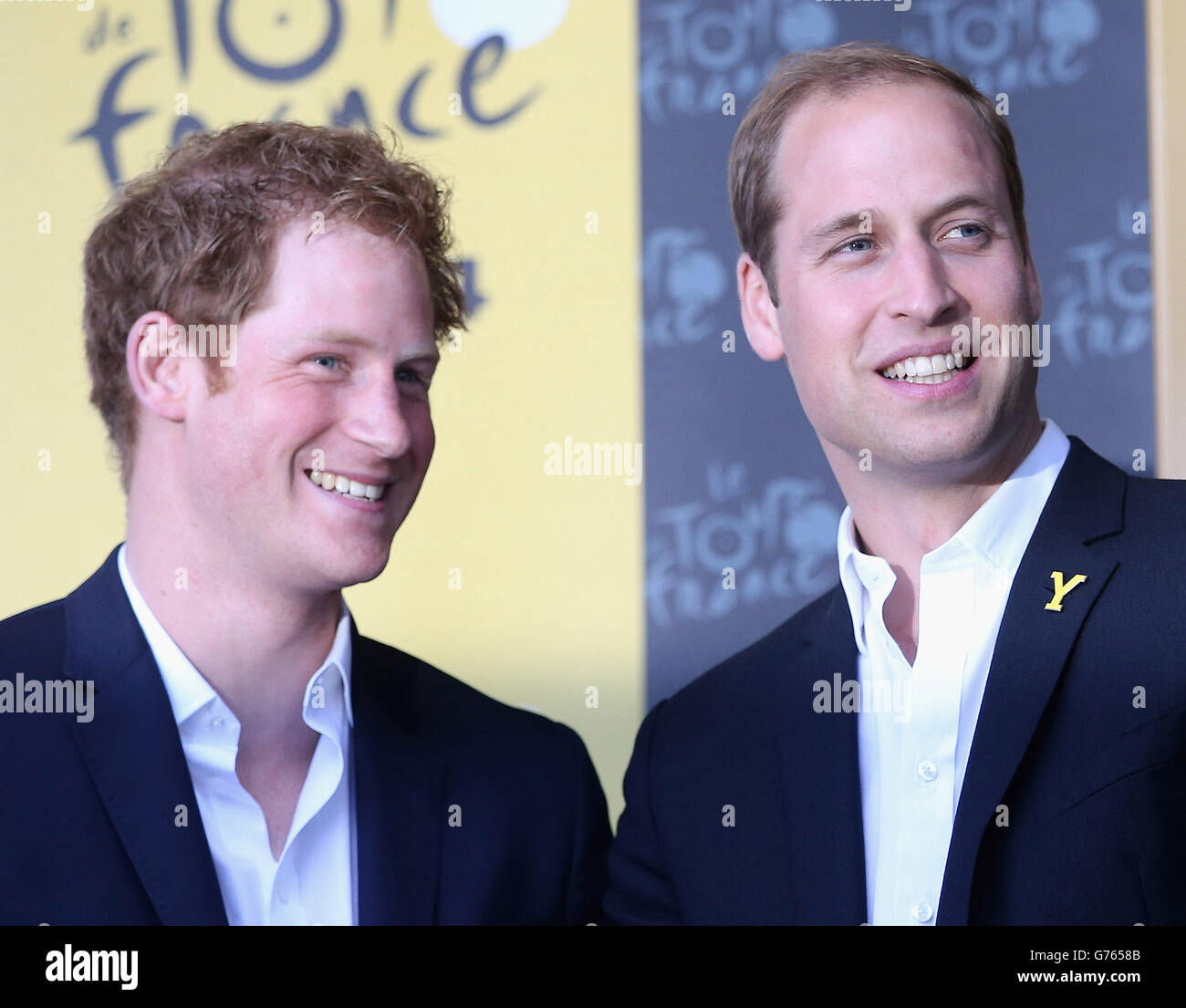 The Duke of Cambridge and Prince Harry laugh on the podium at the ...