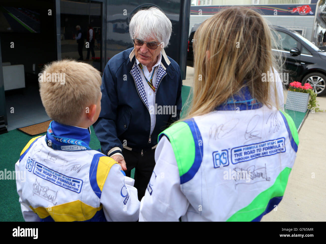 President and CEO of Formula One Management Bernie Ecclestone meets young kart racing drivers ...