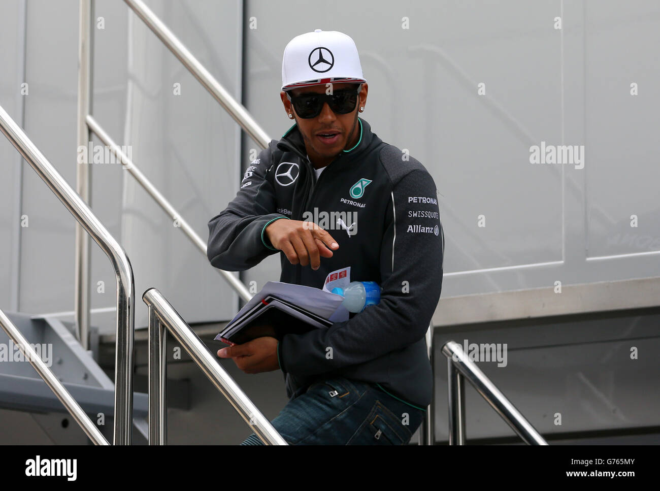 Mercedes' Lewis Hamilton enters the Mercedes motorhome during the 2014 ...