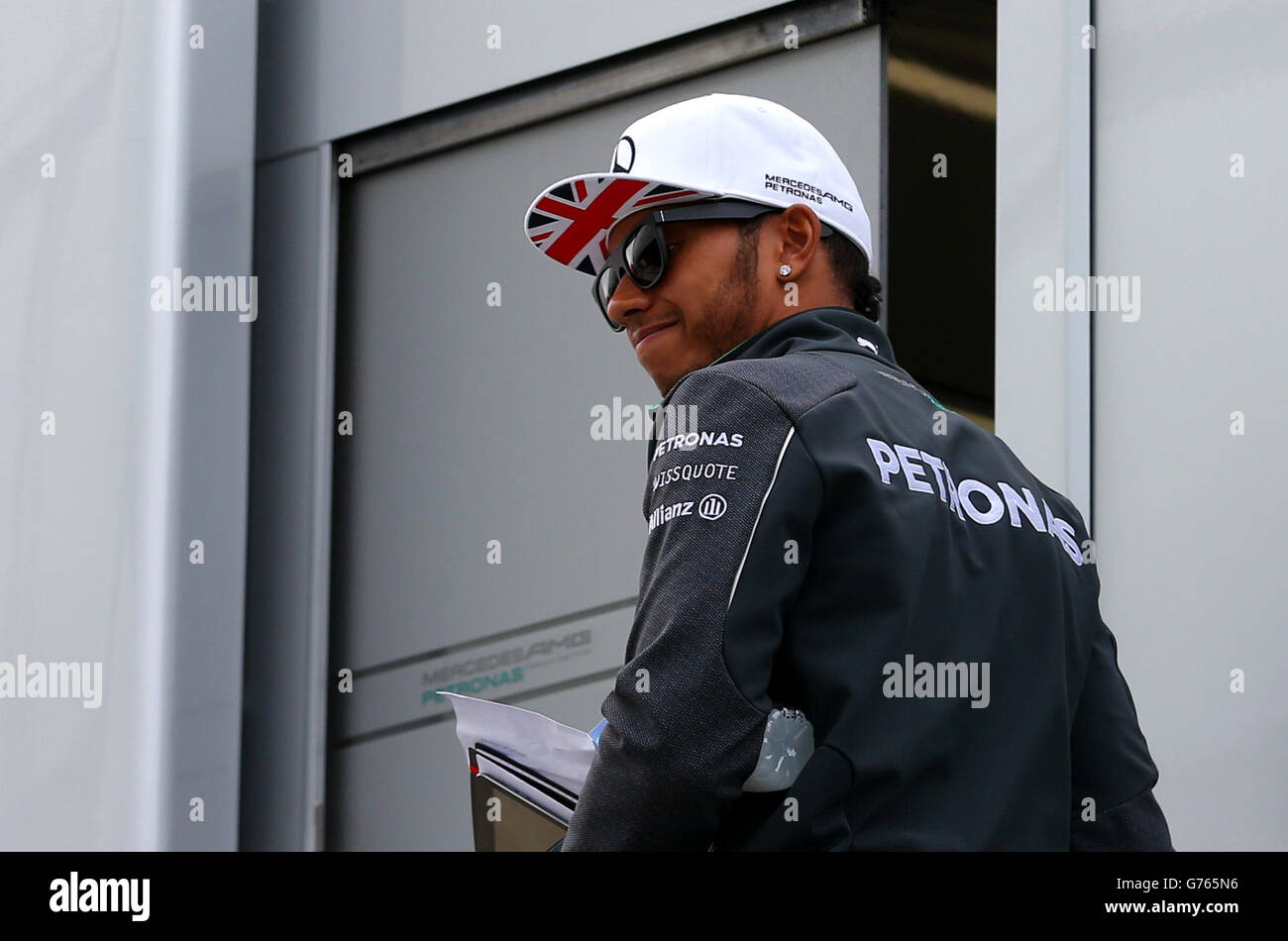 Mercedes' Lewis Hamilton enters the Mercedes motorhome during the 2014 ...