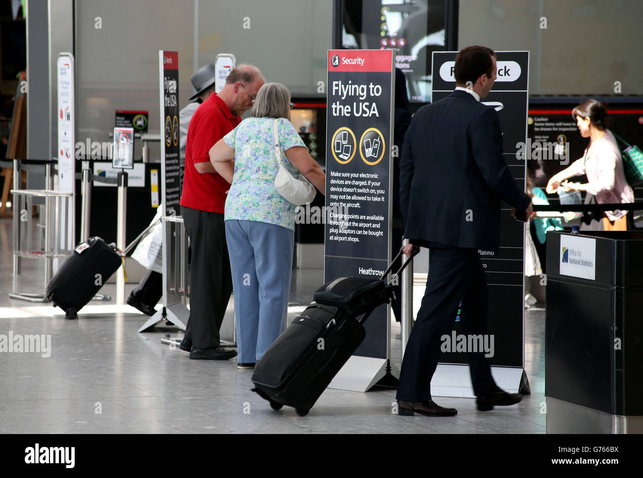 Signs near security in Terminal 5 of Heathrow Airport informing ...