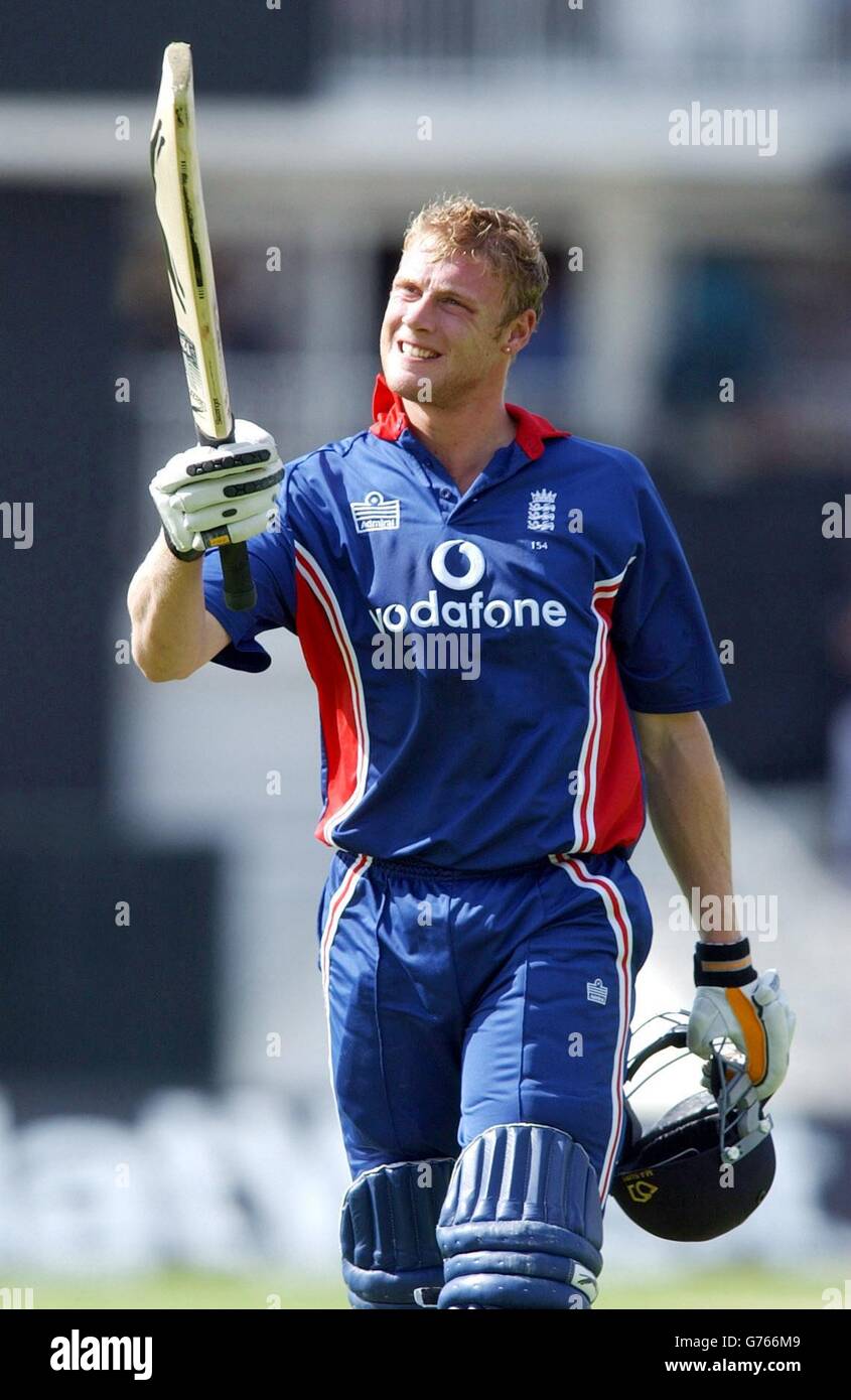 England's Andrew Flintoff looks at his bat after being caught by India ...