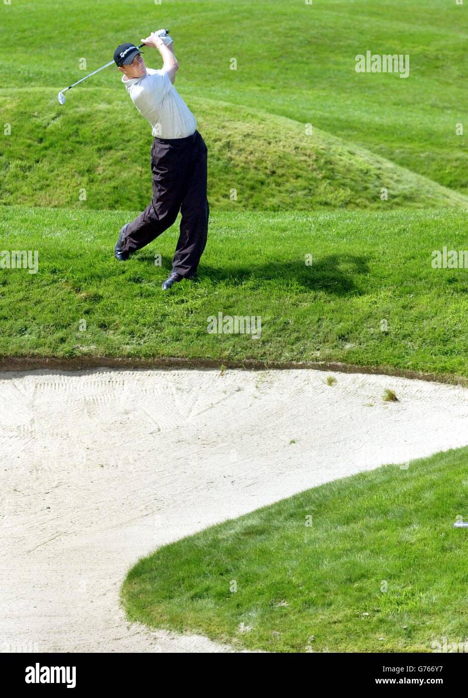 Scottish amateur champion Barry Hume clears the ball from close to a ...