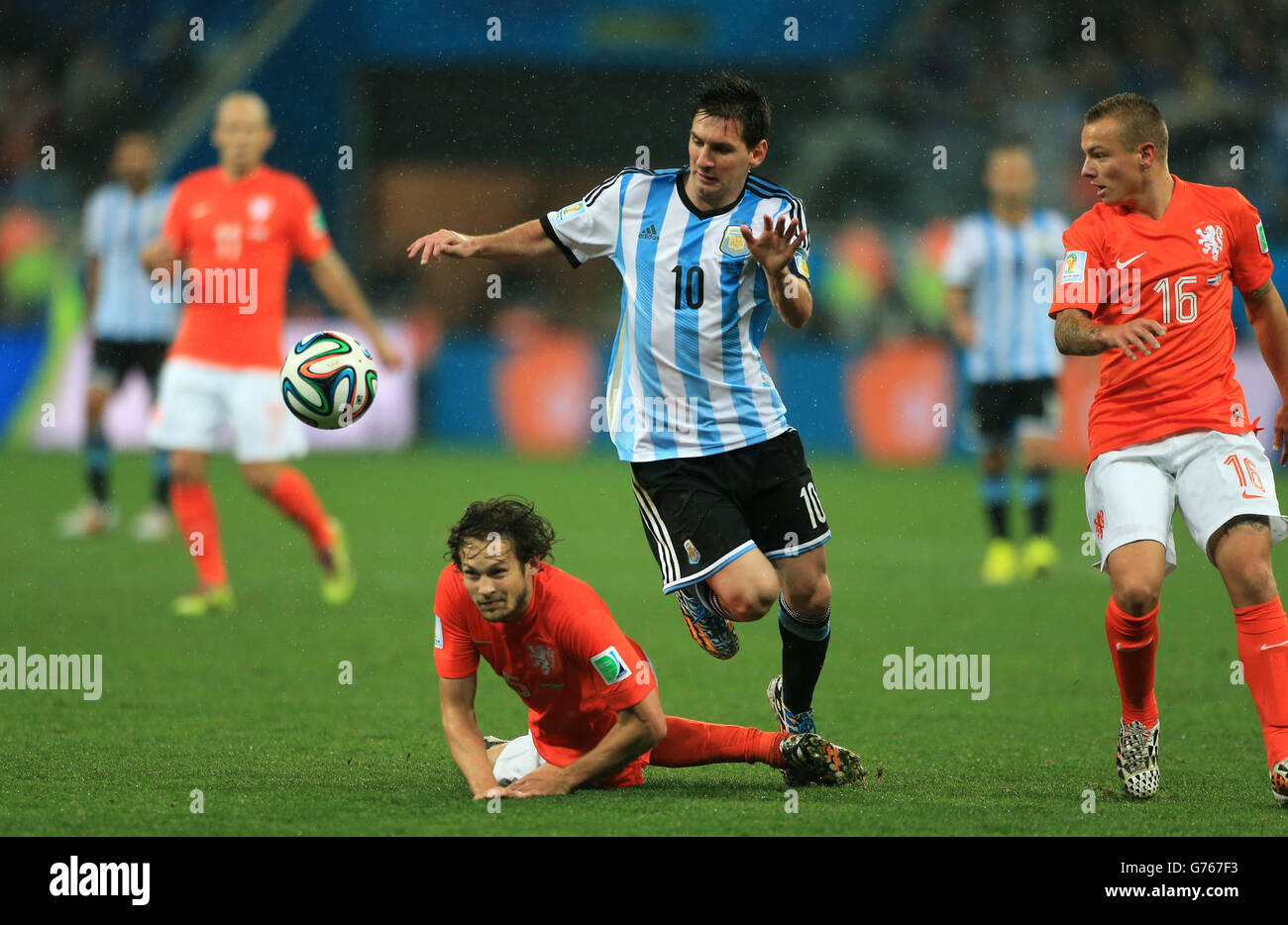 Argentina's Lionel Messi (right) battles for the ball with Netherland's ...