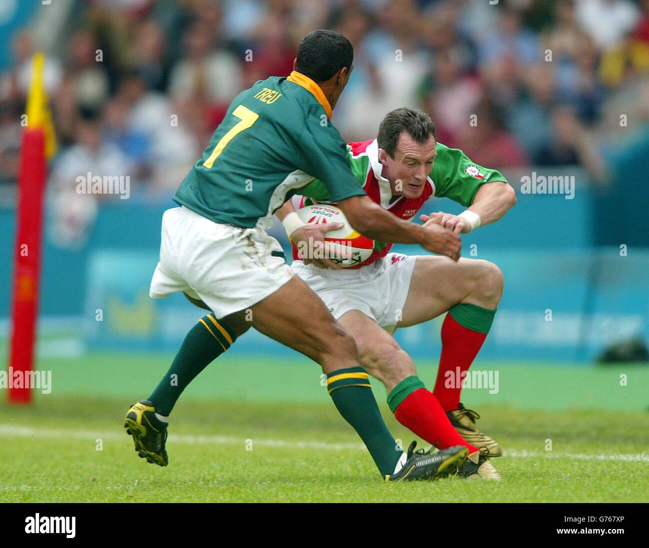 Wales's Robert Howley is tackled by South Africa's Paul Treu during the ...