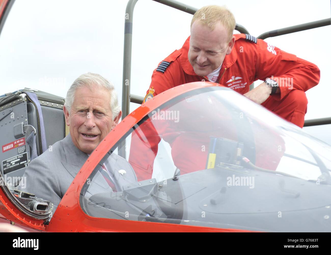 The Prince of Wales is shown a Red Arrows by pilot Neil Fraser during ...