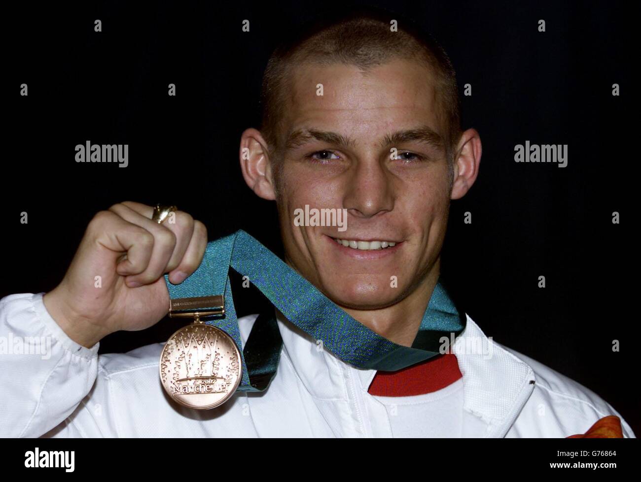 England's Mark Moran celebrates collecting a Commonwealth Bronze medal ...