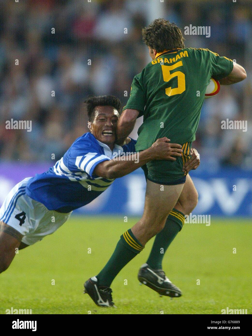 Samoa's Faapito Matagitau tackes Australia's Richard Graham, in the ...