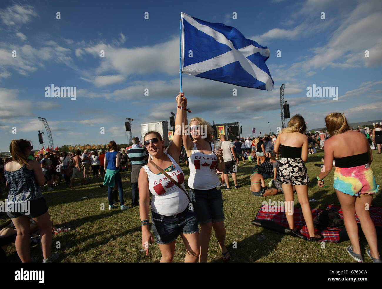 Festival goers waving the Saltire at the T in the Park festival, held ...
