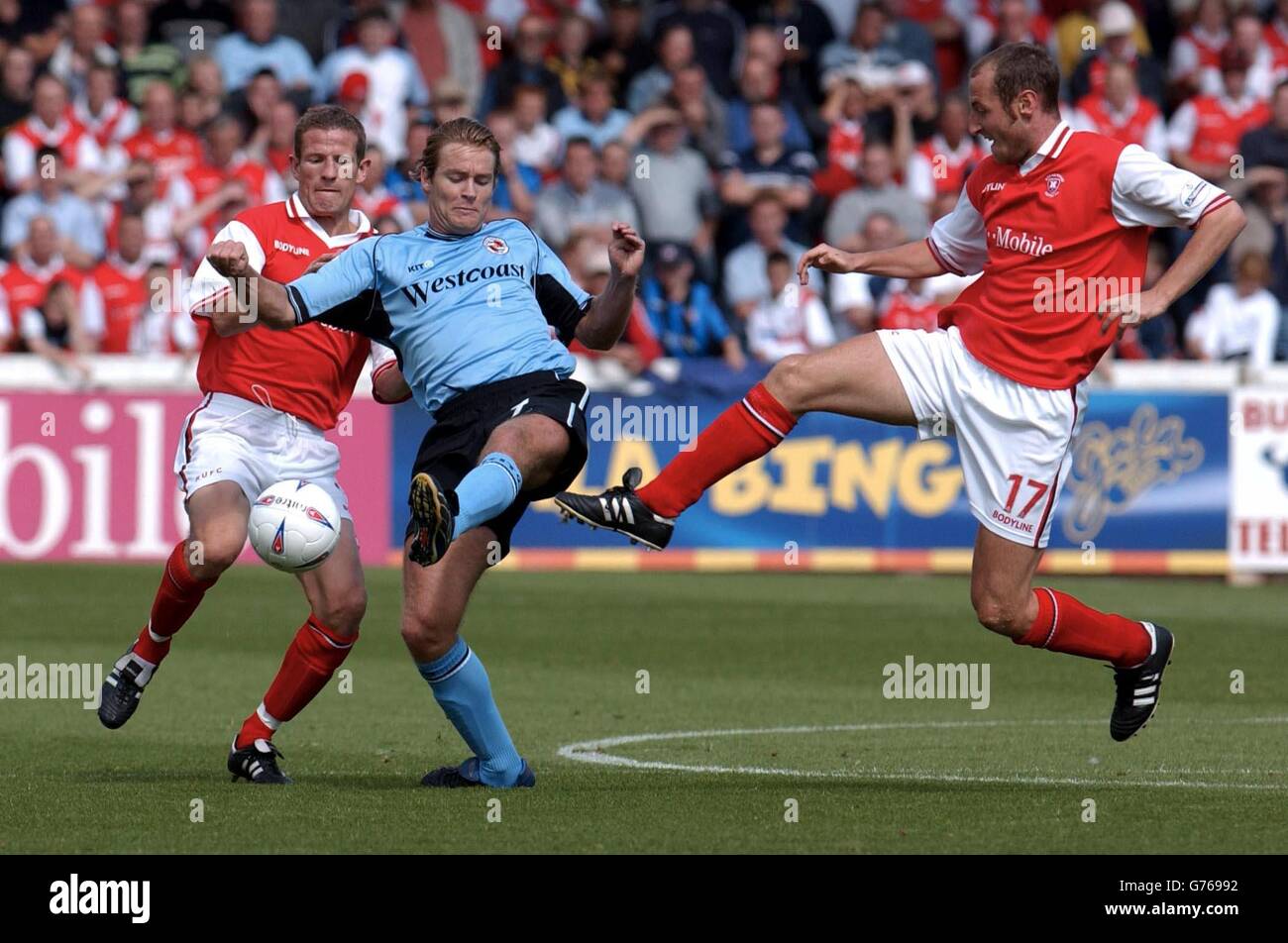 Reading's Martin Butler is trapped between Rotherham's Chris Swales (L ...