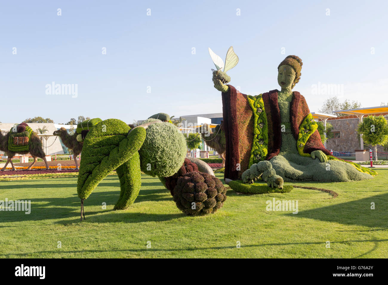 big statues covered in living plants and flowers Stock Photo - Alamy