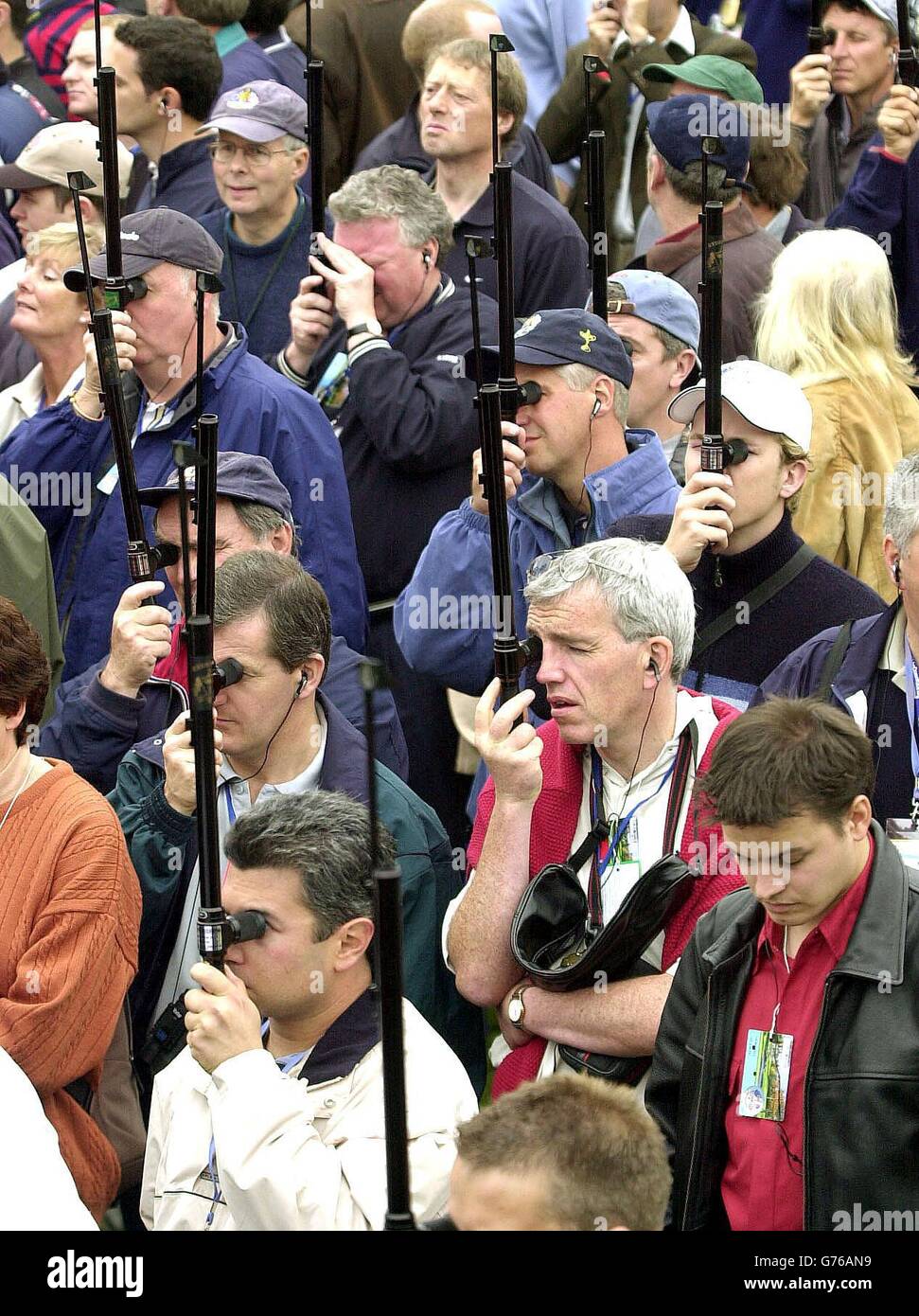 Spectators use periscopes to view play the second day of competition in ...