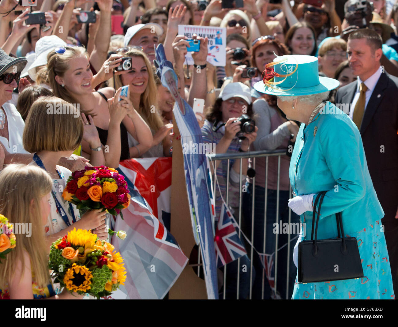 Queen Elizabeth II greets well-wishers as she officially opens Reading ...
