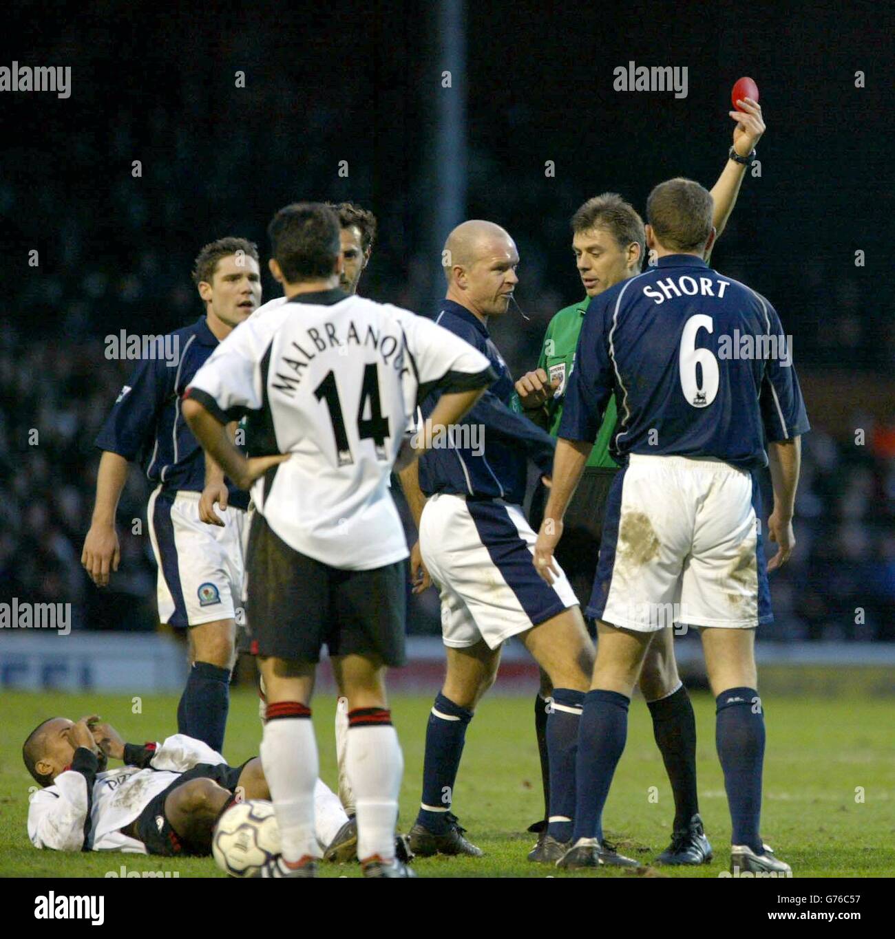 Blackburn's Craig Short is shown the red card by match ref Mark Halsey ...