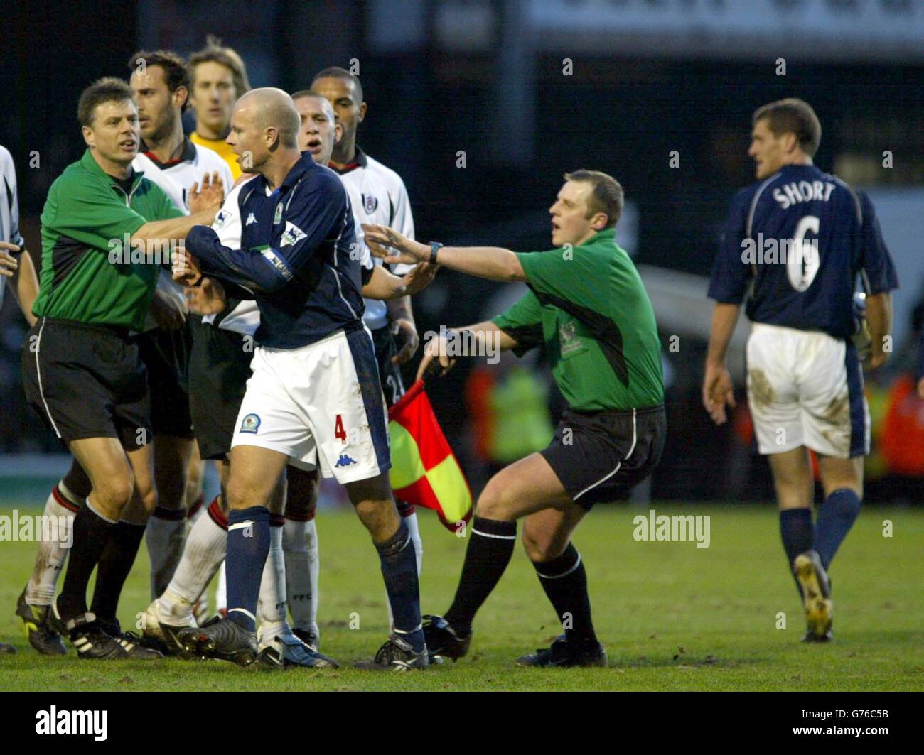Blackburn's Craig Short is shown the red card by match ref Mark Halsey ...