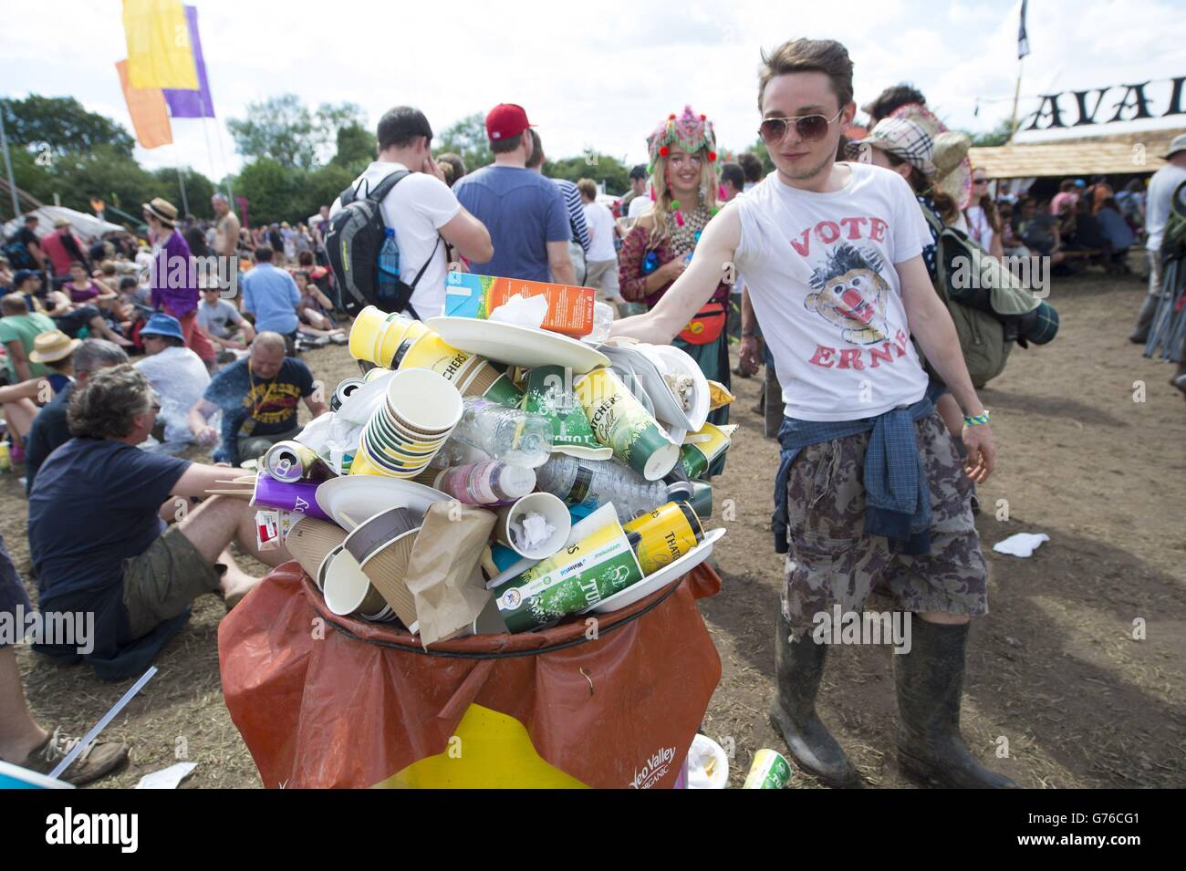 Festivalgoers use recycling bins at the Glastonbury Festival, at Worthy ...