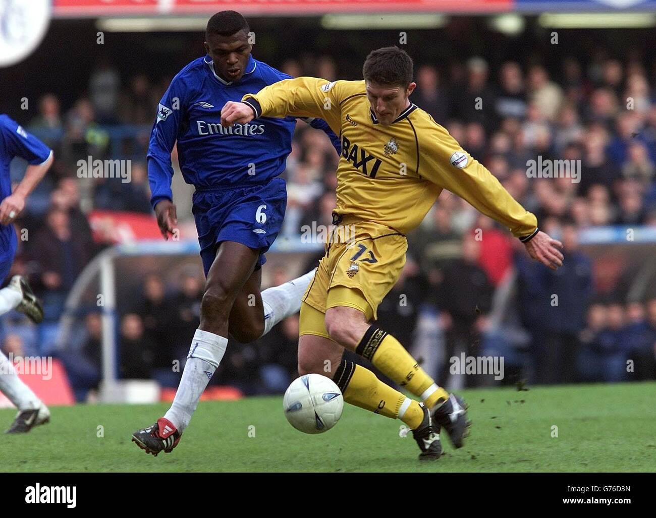 Jon Macken of Preston (right), shoots under pressure from Marcel ...
