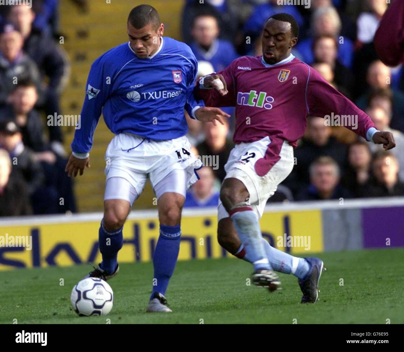 Ipswich Town's Jermaine Wright (L) holds off Aston Villa's Darius ...