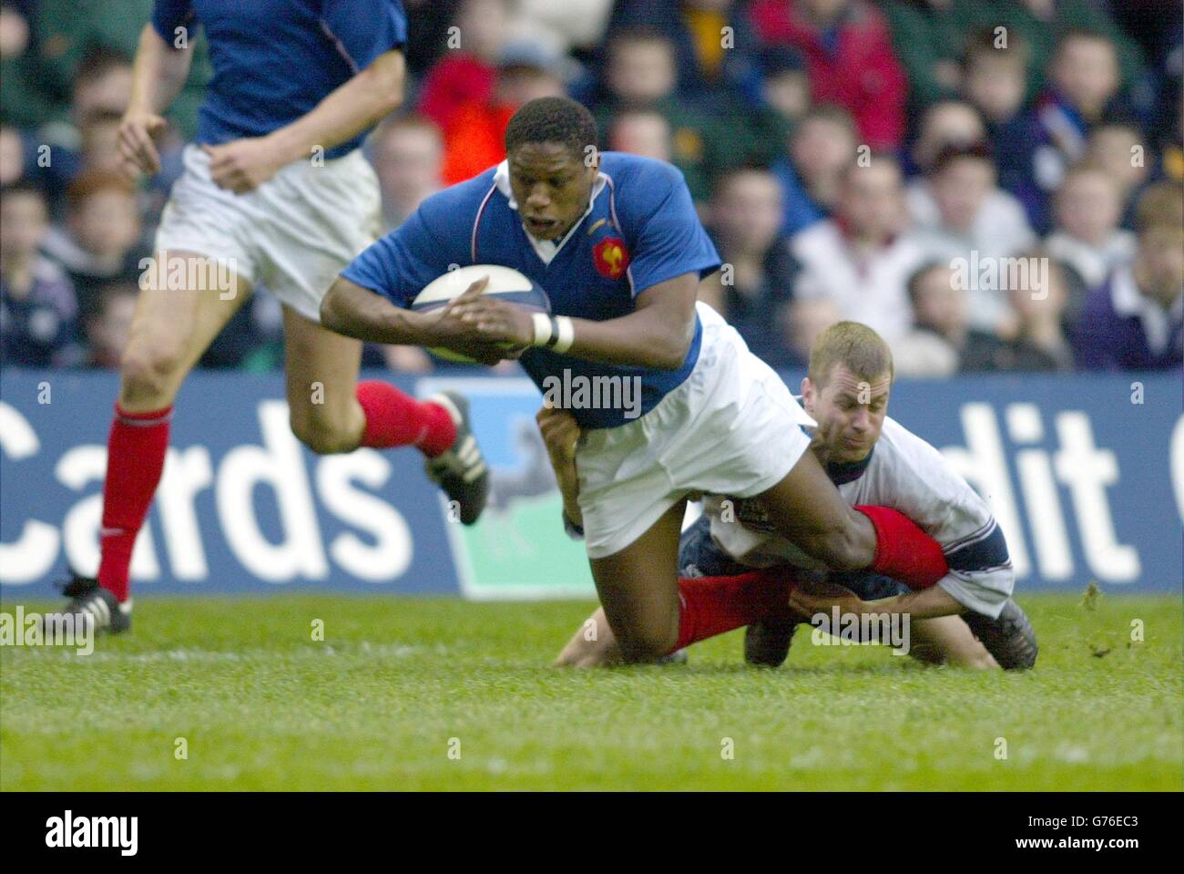 France's Jimmy Marlu is tackled by Scotland's Chris Paterson during ...